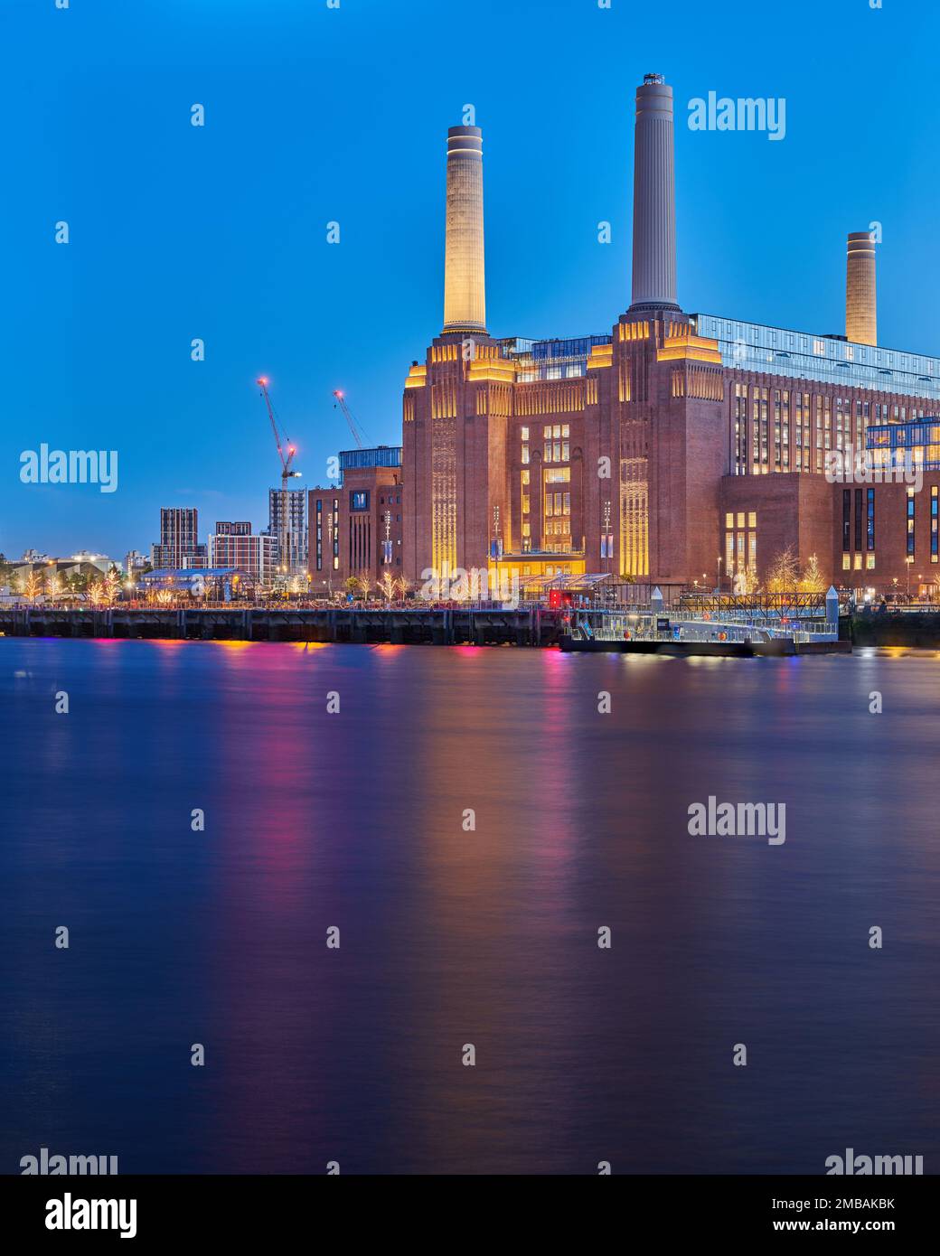 Lit at night, the disused coal fired Battersea Power Station, now a ...