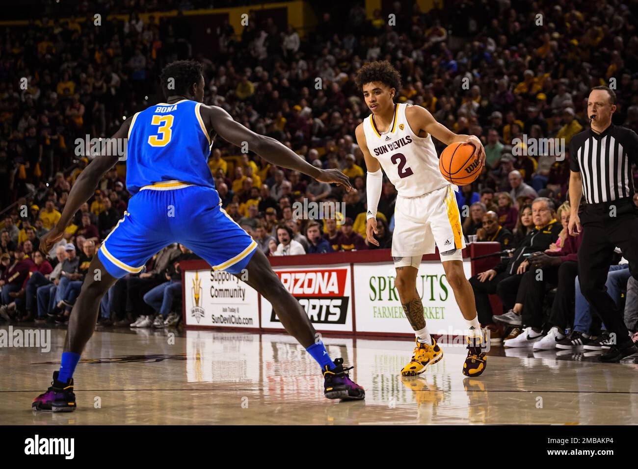 Arizona State guard Austin Nunez (2) drives towards the basket in the ...