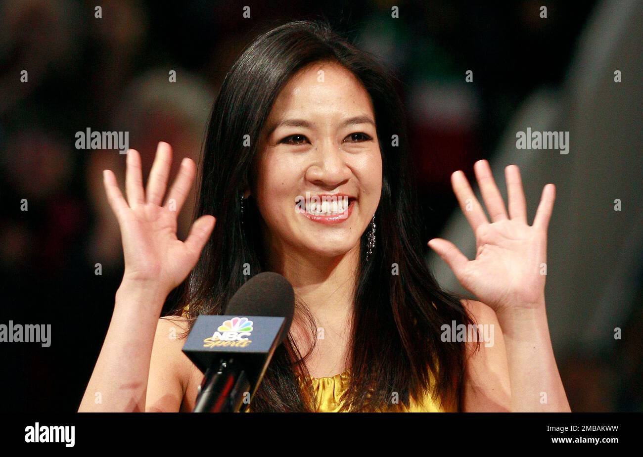 FILE - Former figure skater Michelle Kwan waves at an on-ice ...