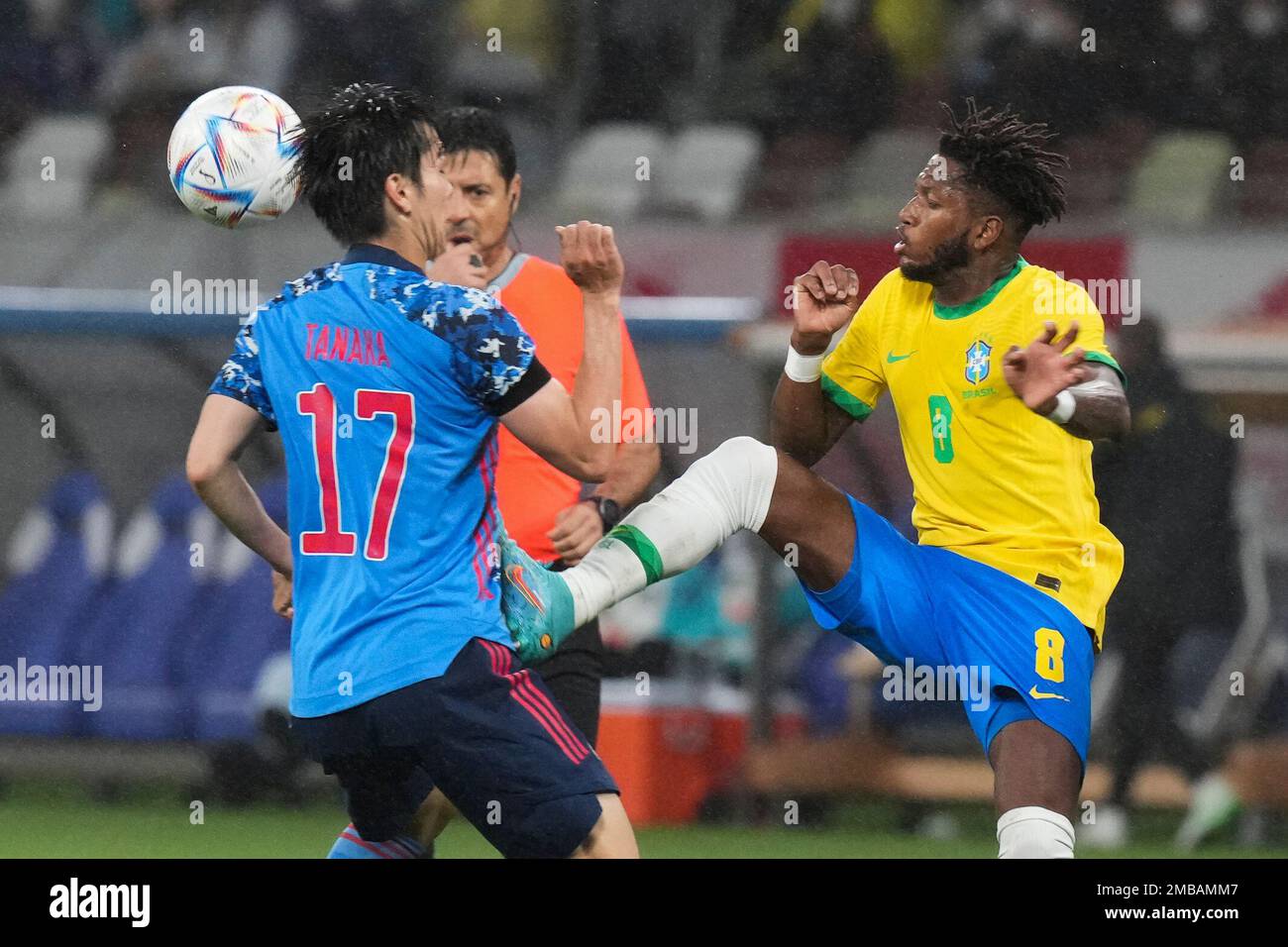 Fred of Brazil, left, and Ao Tanaka of Japan tussle for the ball during ...
