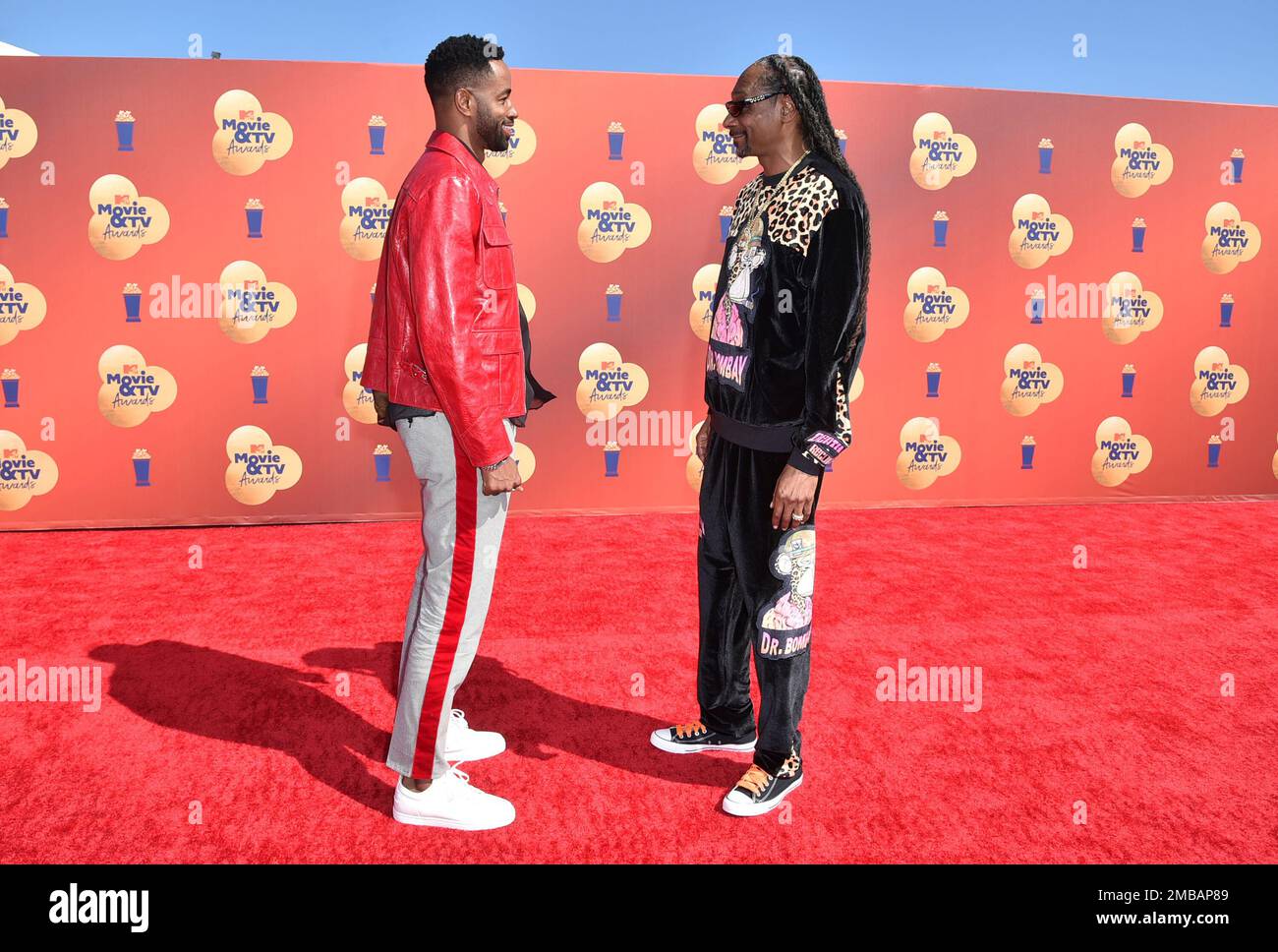 Jay Ellis, left, Snoop Dogg arrive at the MTV Movie and TV Awards on ...