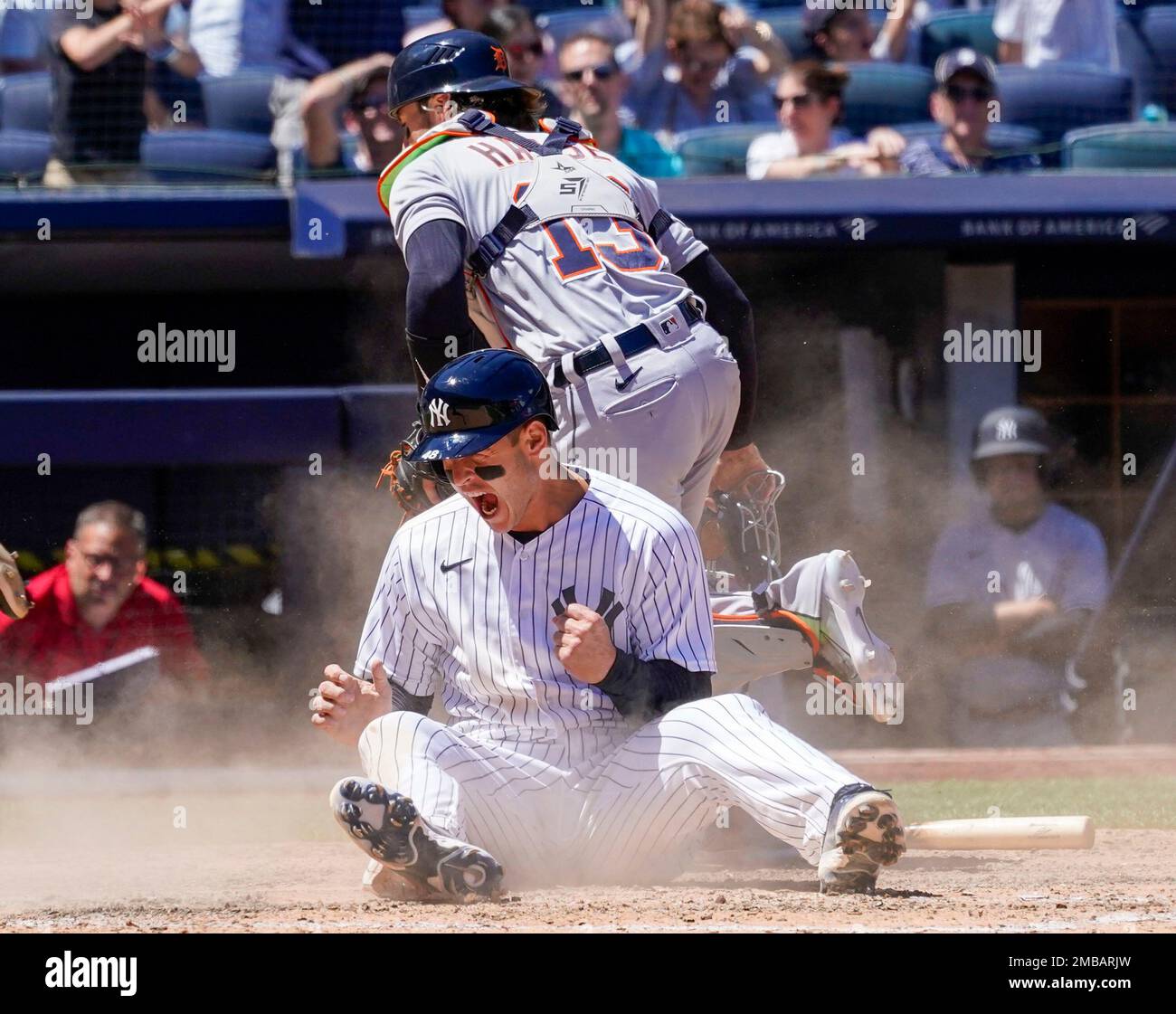 New York Yankees' Anthony Rizzo reacts after sliding into home base and ...
