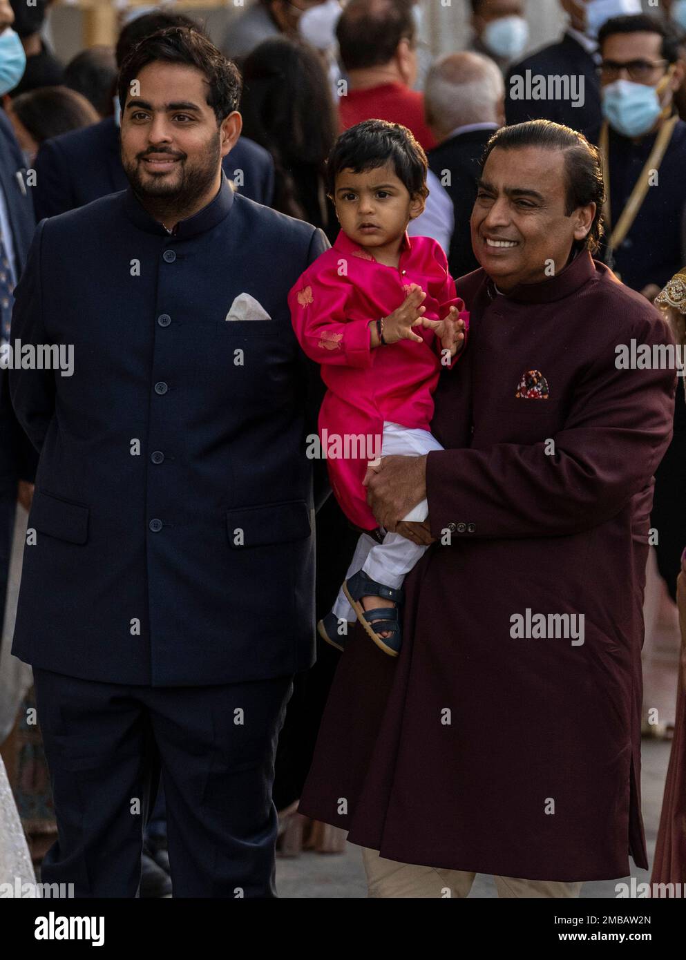 Reliance Industries Limited Chairman Mukesh Ambani carries his grandson Prithvi Akash Ambani as ...