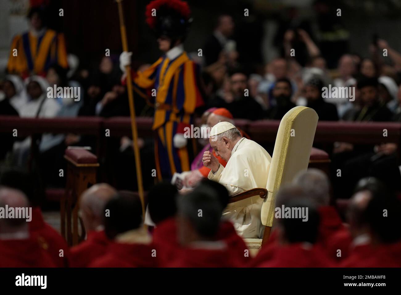 Pope Francis brings his hand to his face as he attends a Pentecost Mass ...