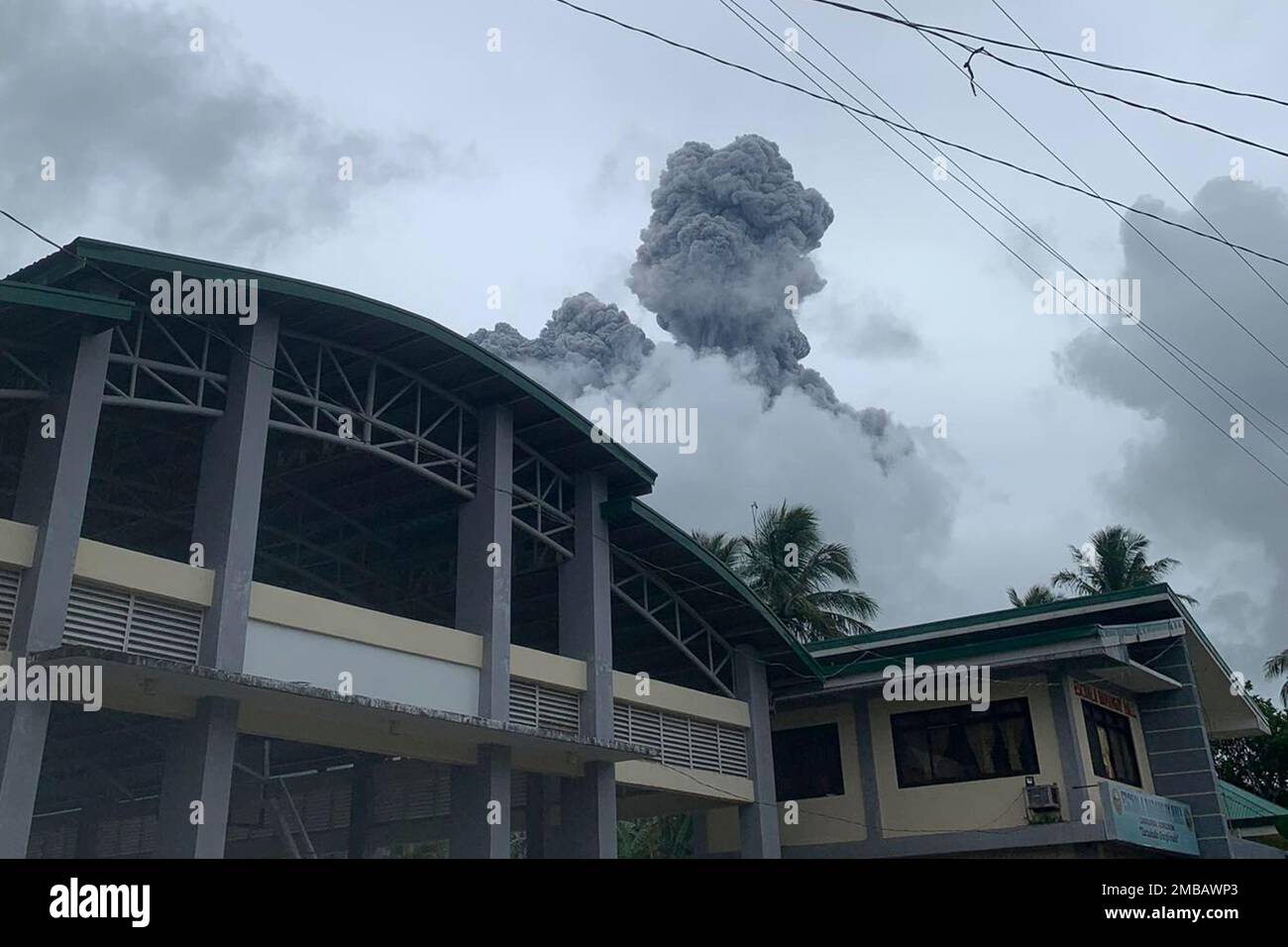 Ash and steam are spewed from Mount Bulusan as seen from Casiguran ...