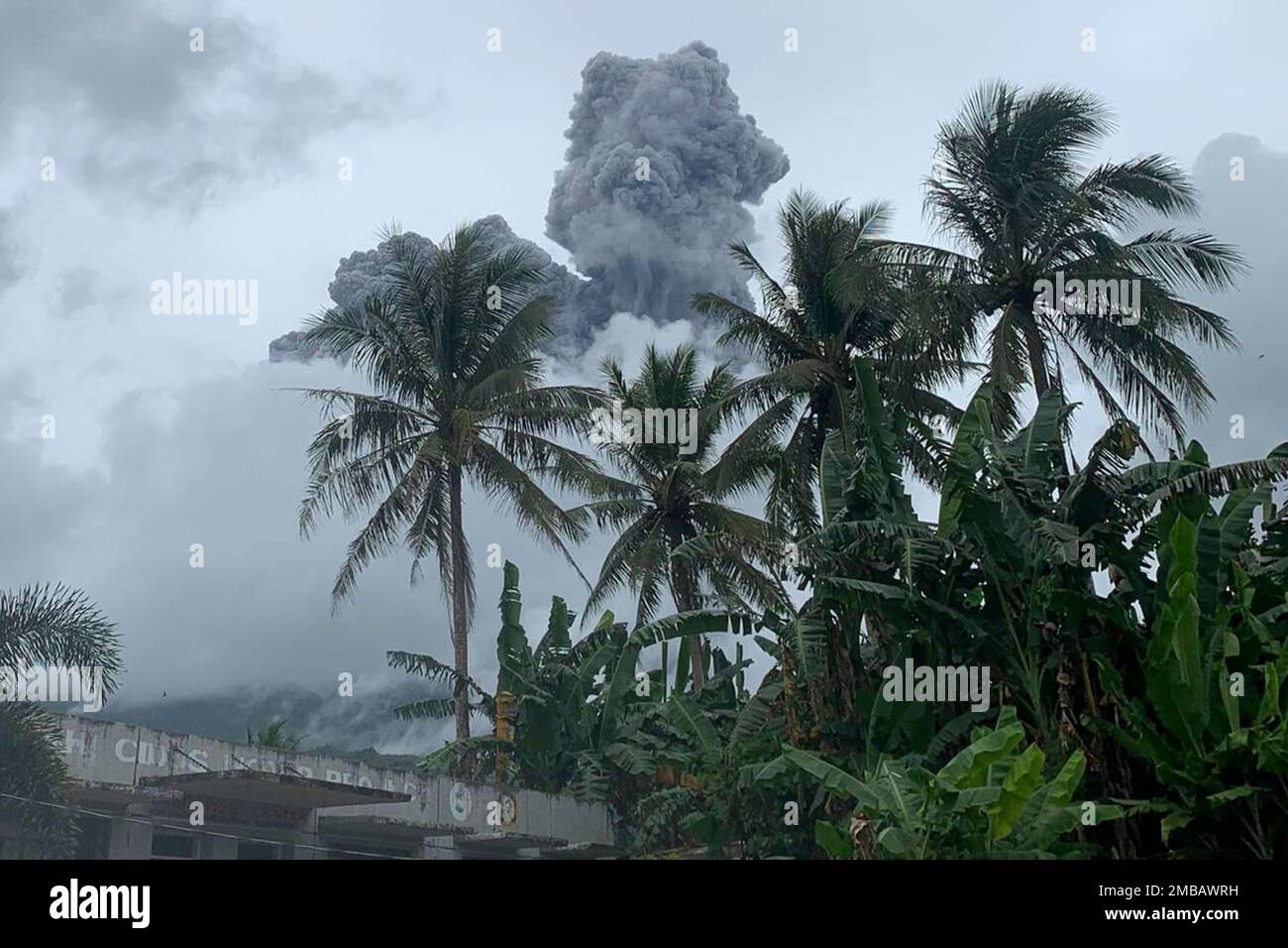 Ash and steam are spewed from Mount Bulusan, as seen from Casiguran ...