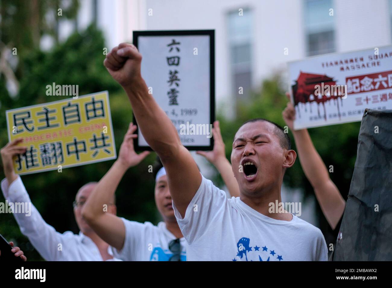 A man shouts slogans during a protest outside the Chinese Consulate ...