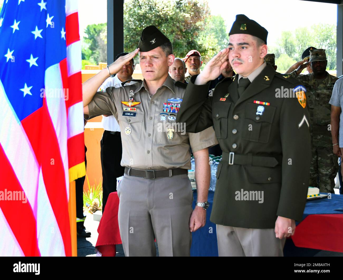 Left, U.S. Army Garrison Italy Commander, Col. Matthew Gomlak, and Pv2 ...