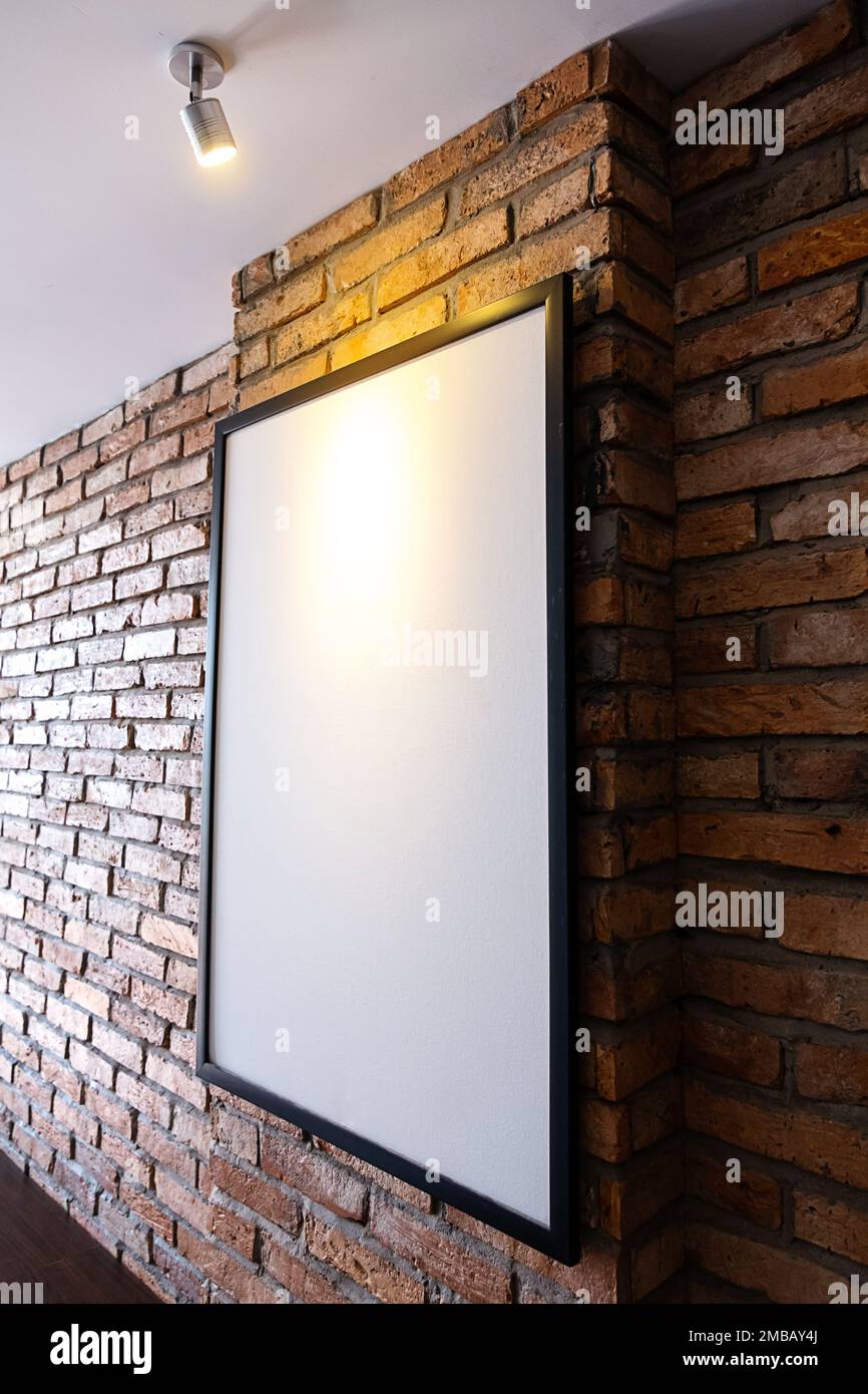 Mock up poster on brick wall. Template display for your adverting or ...