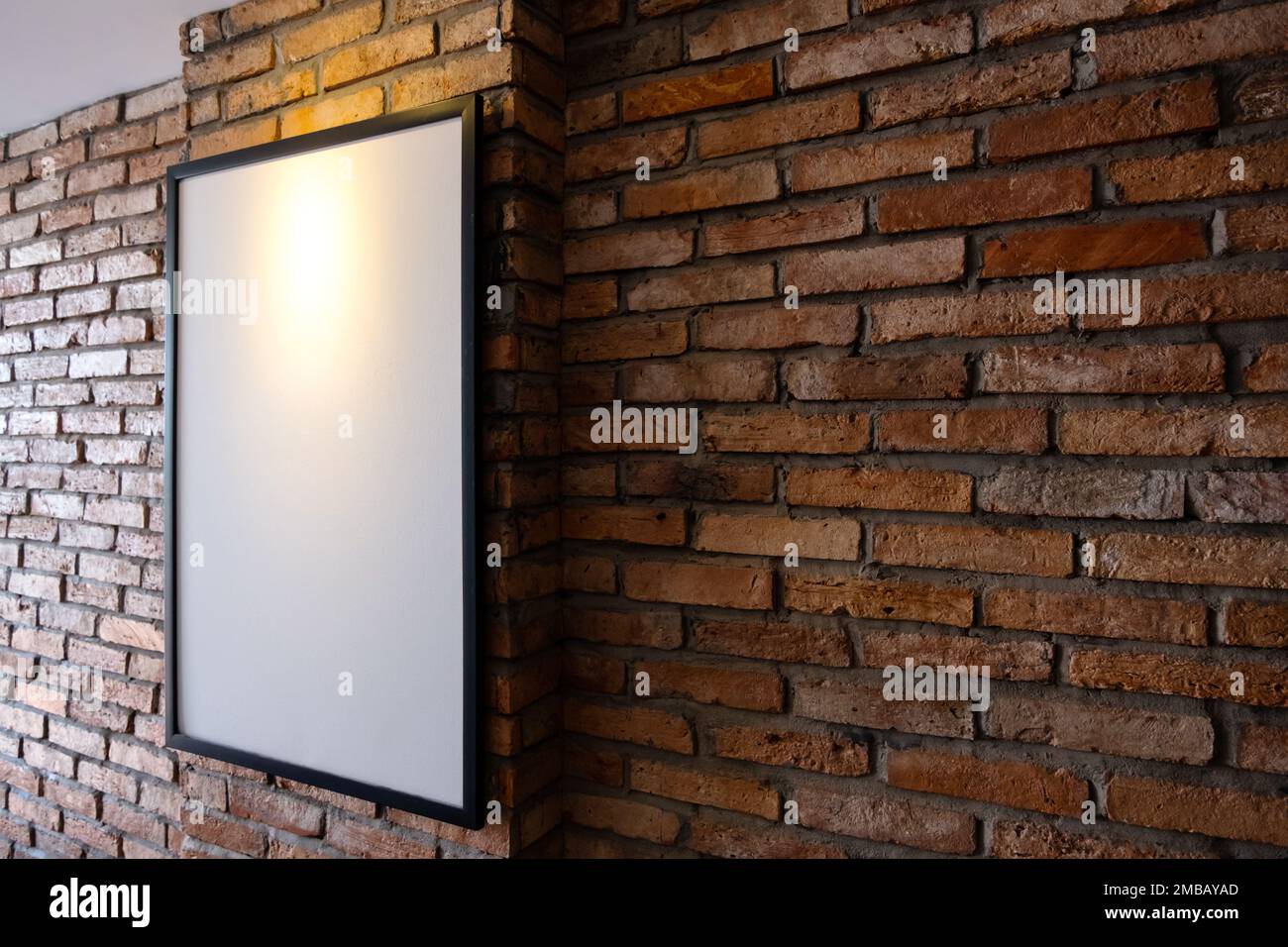 Mock up poster on brick wall. Template display for your adverting or ...