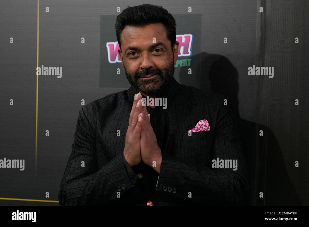 Indian actor Bobby Deol greets as he arrives to attend the 22nd ...