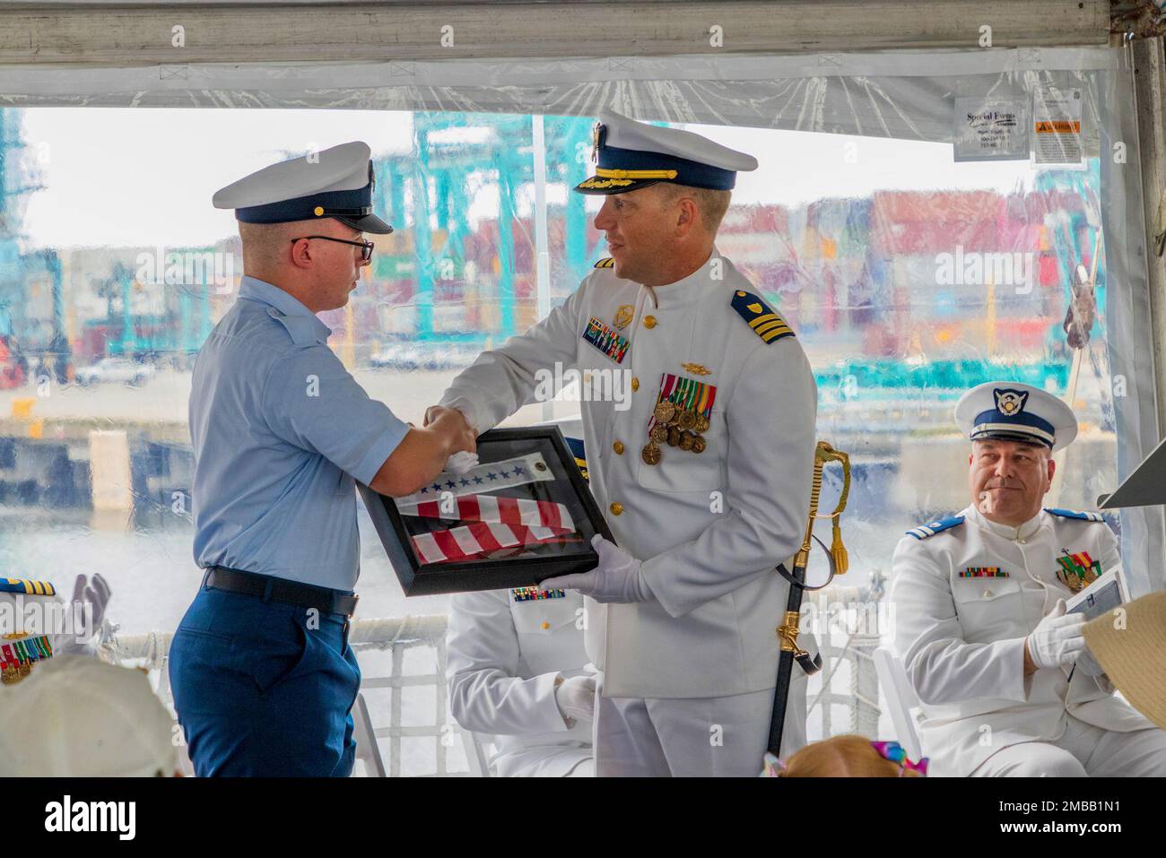 Cmdr. Malcolm Belt receives his commissioning pennant from the most ...