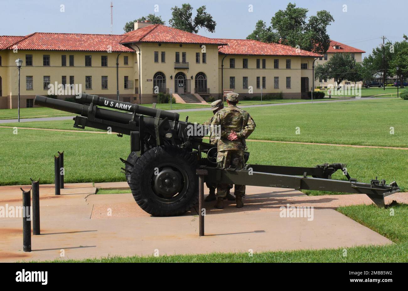 Spc. Tyrique Gordon and Spc. Marcus Jefferson loads a blank shot into ...