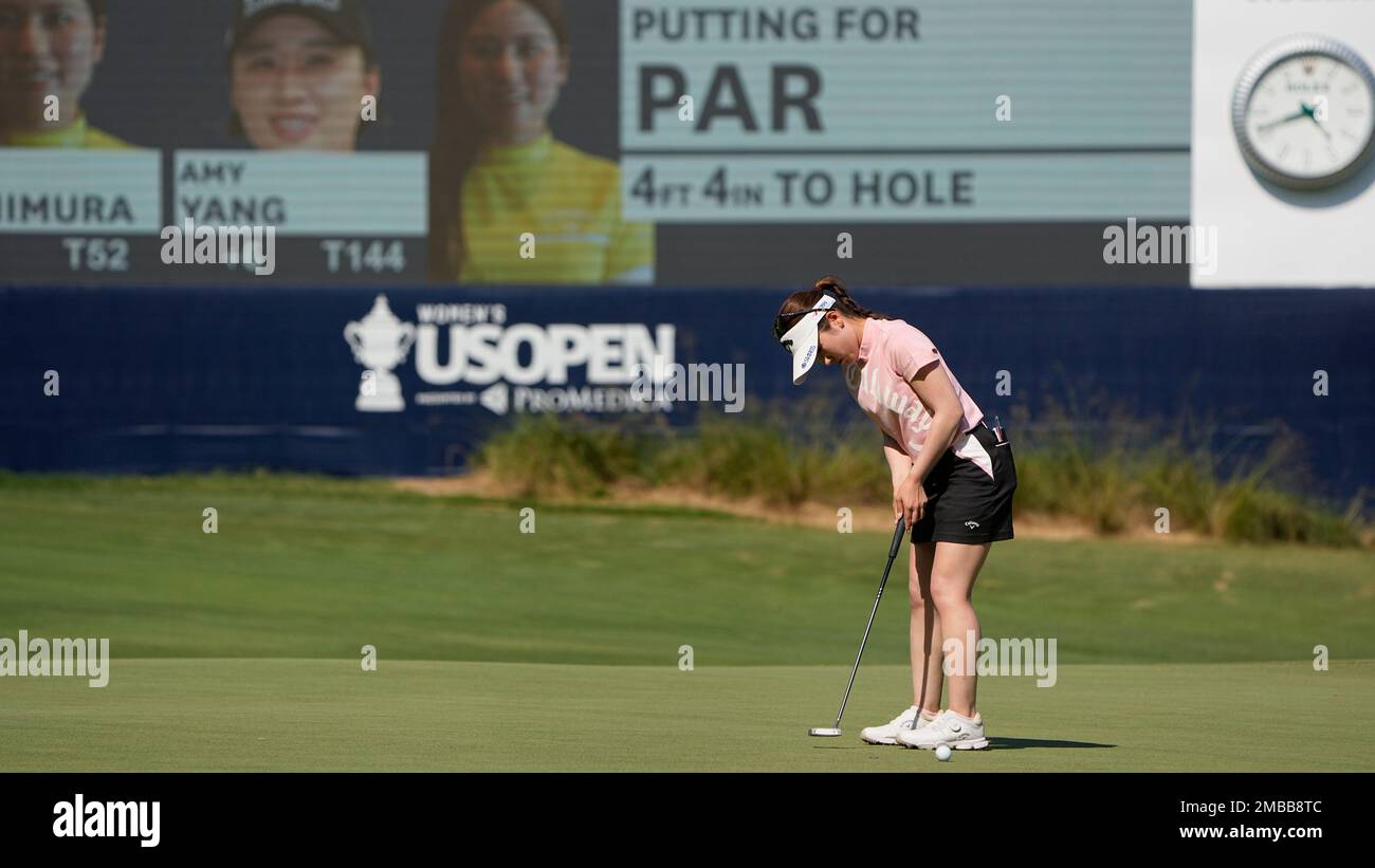 Yuna Nishimura, of Japan, lines up a putt on the 18th green during the first round of the U.S ...