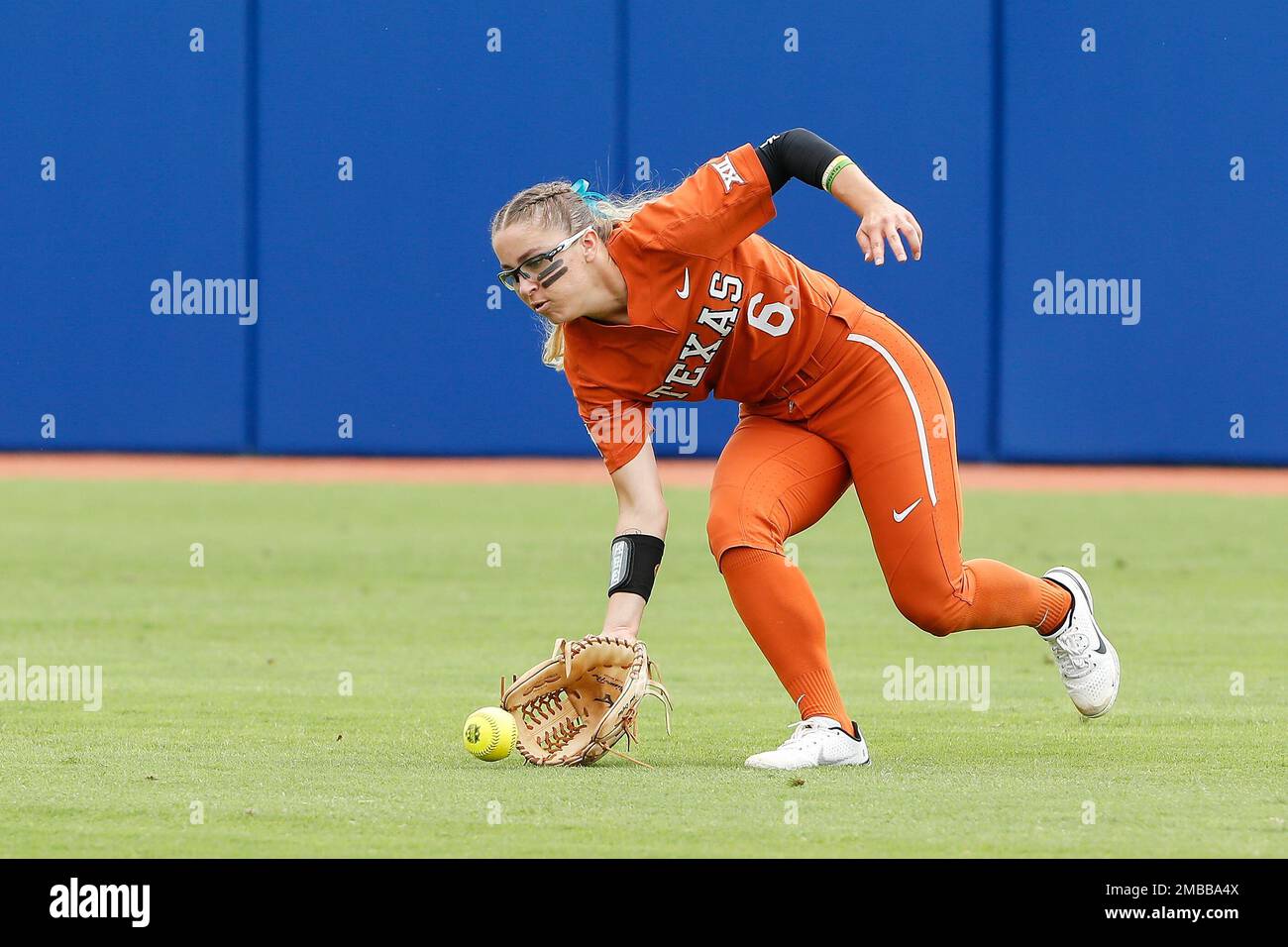 Texas outfielder Isabella Dayton (6) scoops up a UCLA hit to the ...
