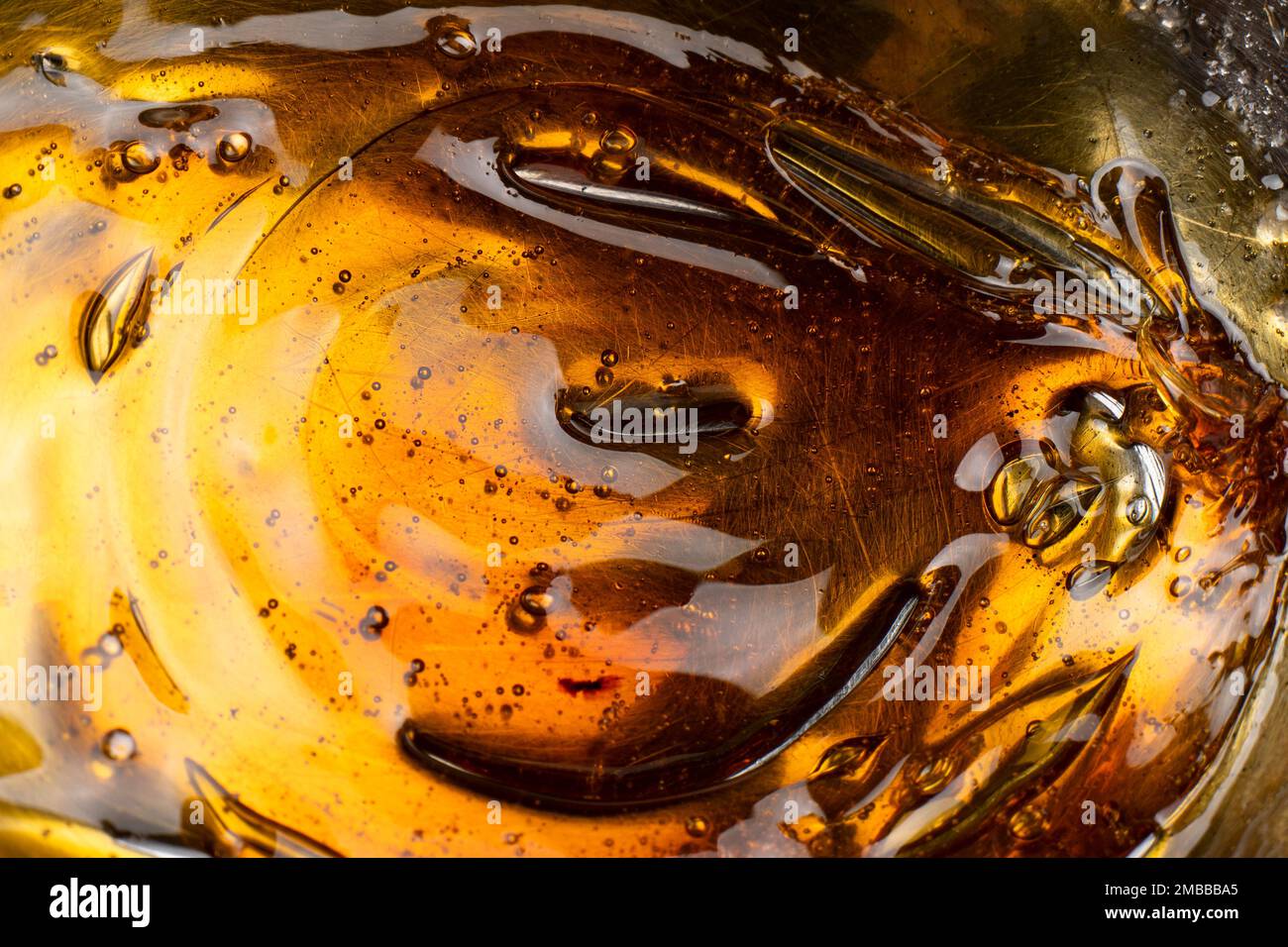 clean thc extract golden cannabis wax Stock Photo - Alamy