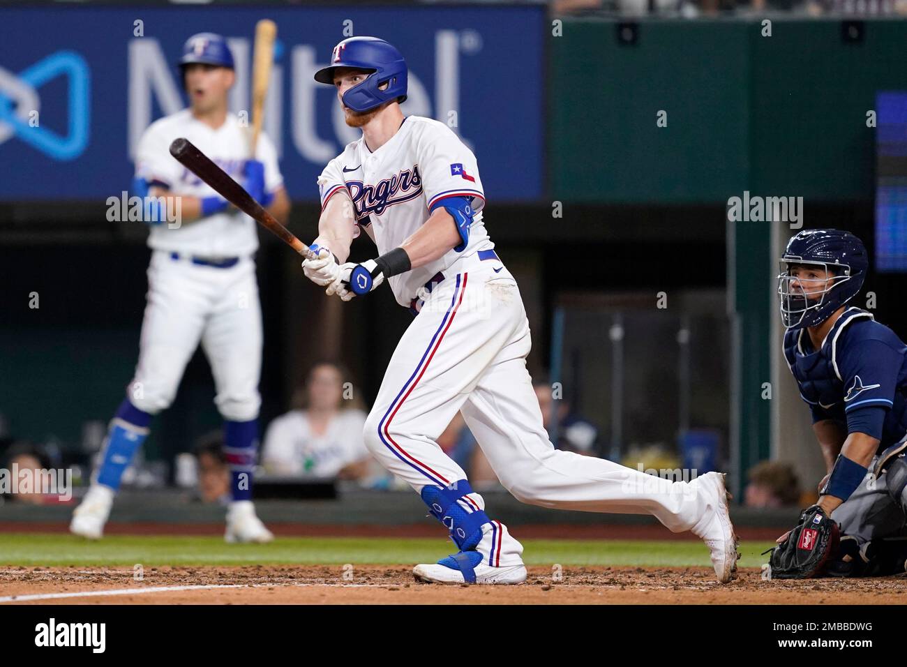Texas Rangers' Sam Huff follows through on a double next to Tampa Bay ...