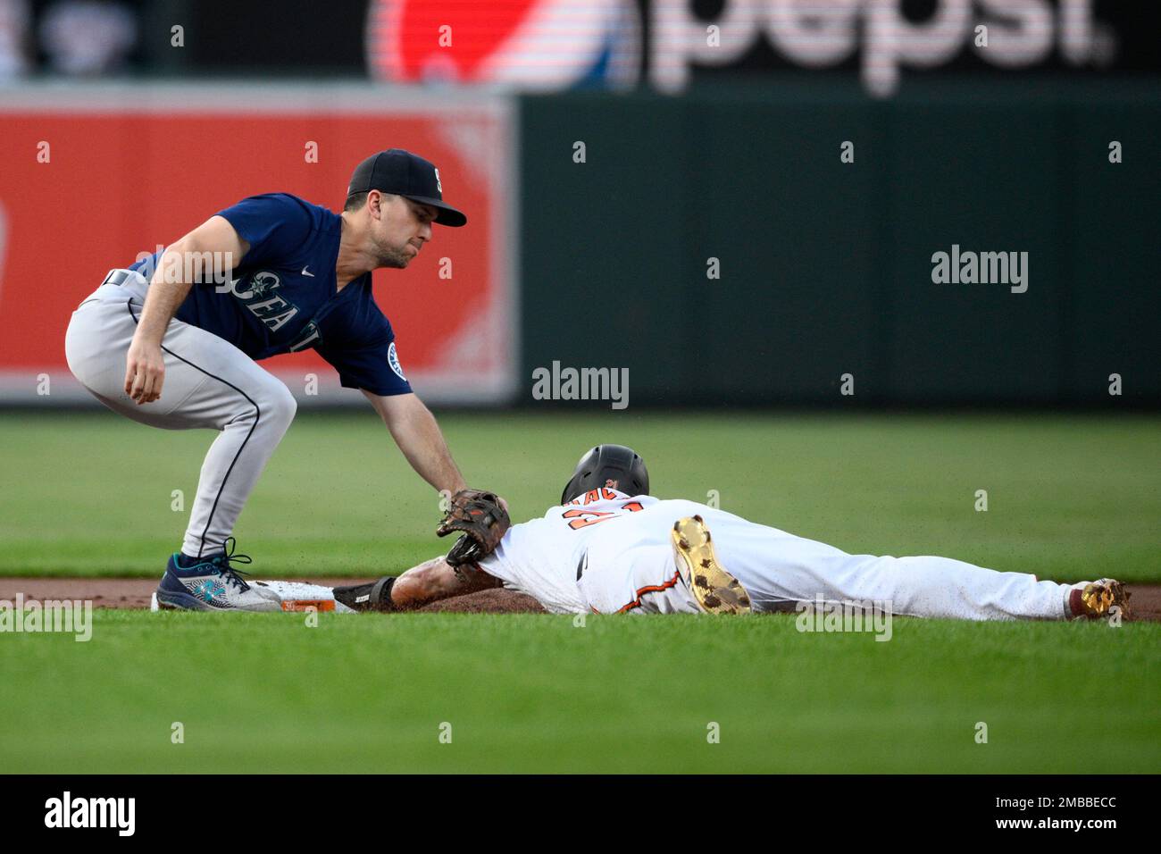 Baltimore Orioles' Austin Hays, right, is tagged out attempting to ...