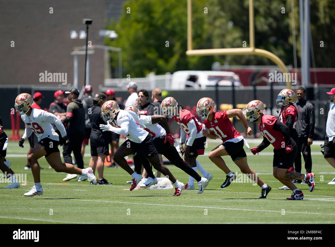 San Francisco 49ers players warm up at the NFL football team's practice ...