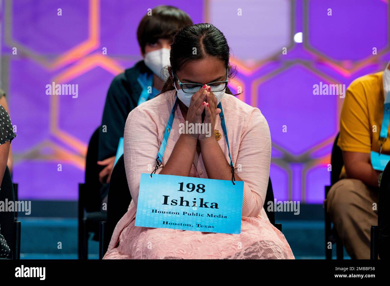 Ishika Varipilli, 11, from Spring, Texas, waits on stage during the Scripps National Spelling ...