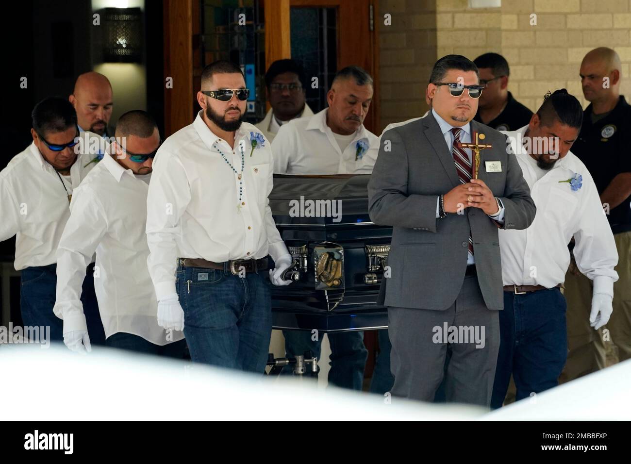 Pallbearers carry the casket of Jose Flores Jr. after a funeral service ...