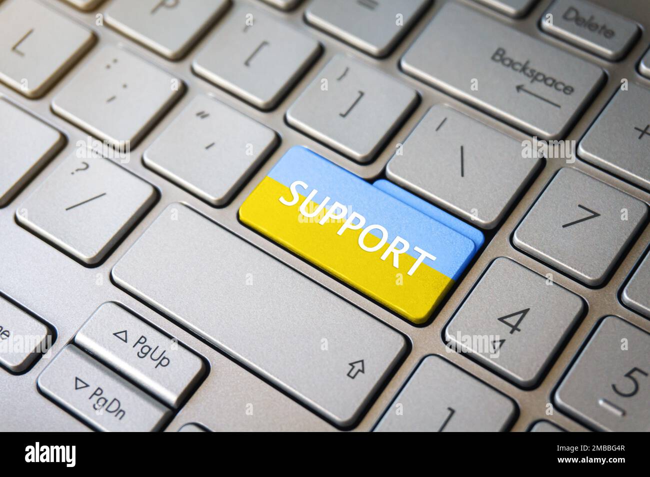 Support Ukraine, text and Ukrainian flag on silver keyboard enter key ...