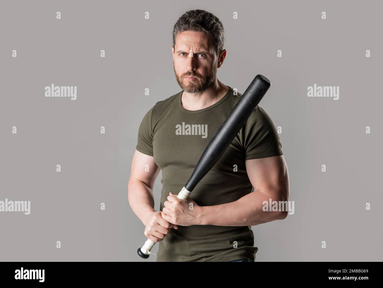 serious man express aggression with bat isolated on grey background ...