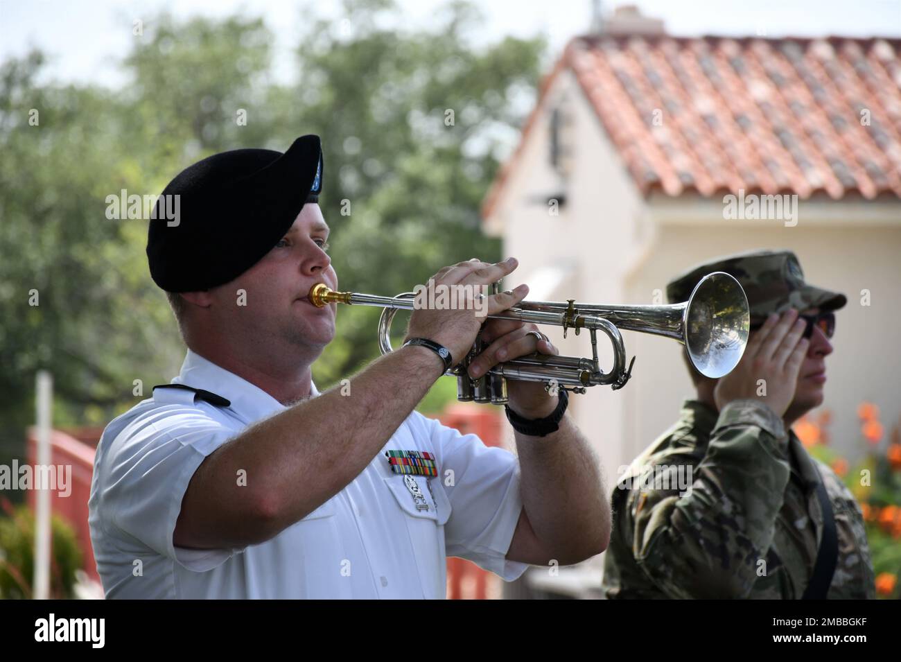 Sgt. Ben Forshee, 323d Army Band bugler, plays "Retreat" during a ...
