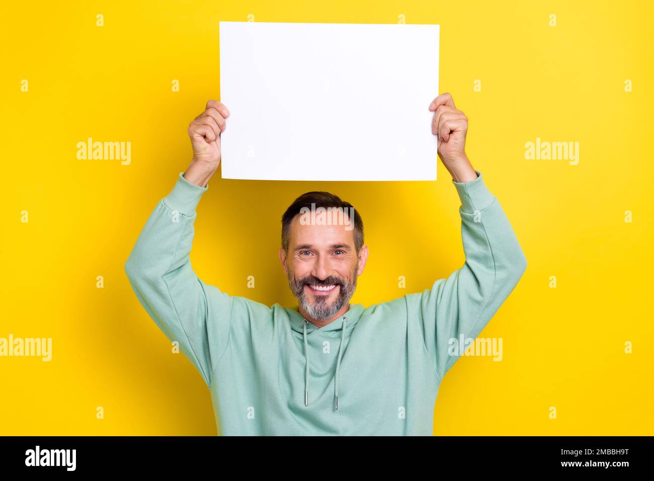 Photo of smiling positive good mood grey beard middle aged man hold ...