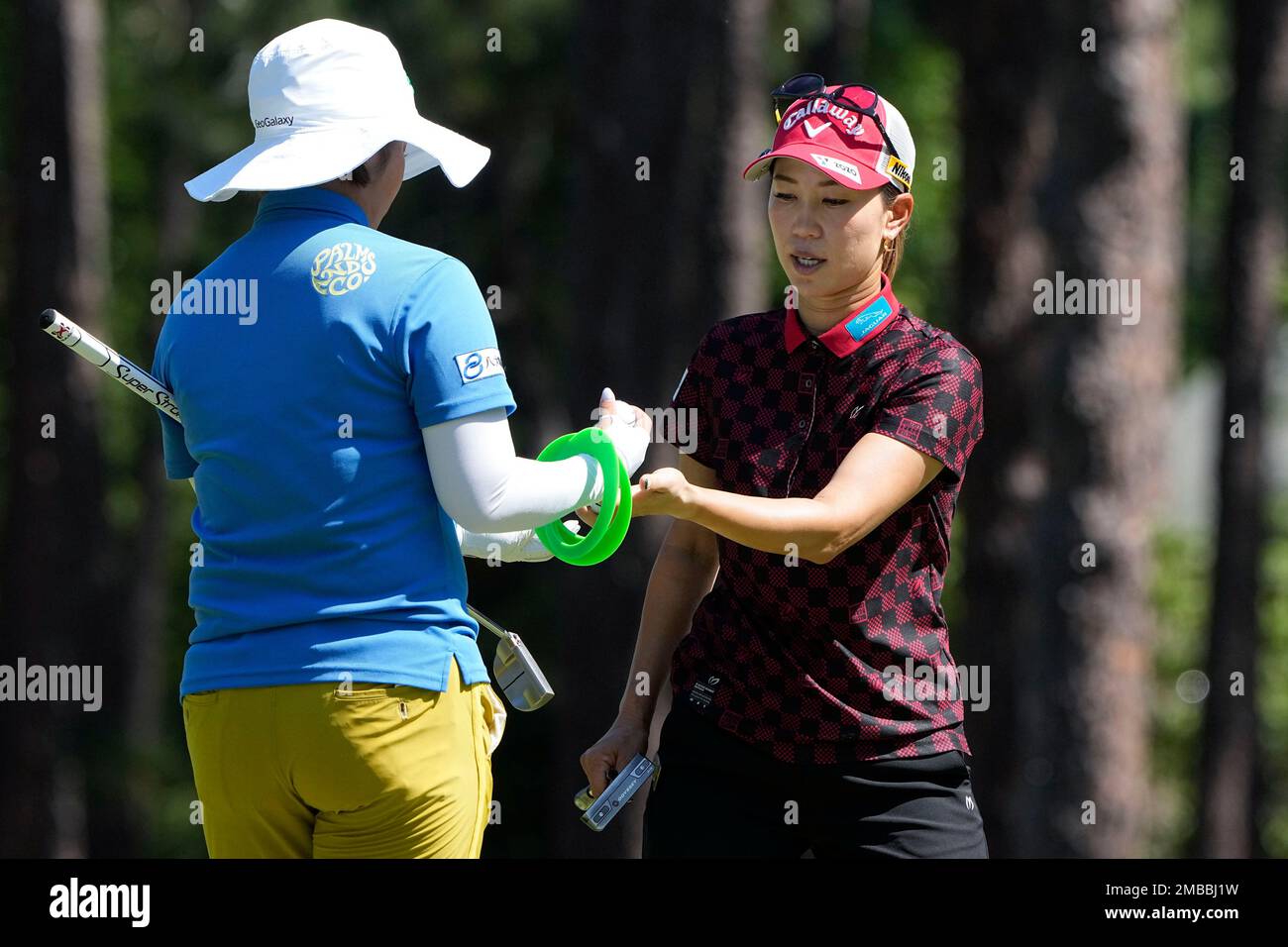 Momoko Ueda, of Japan, left, speaks with Yuri Onishi, of Japan, during ...