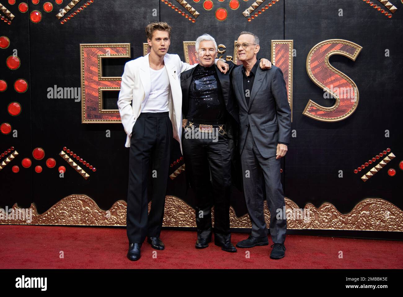 Austin Butler, director Baz Luhrmann and Tom Hanks pose for ...