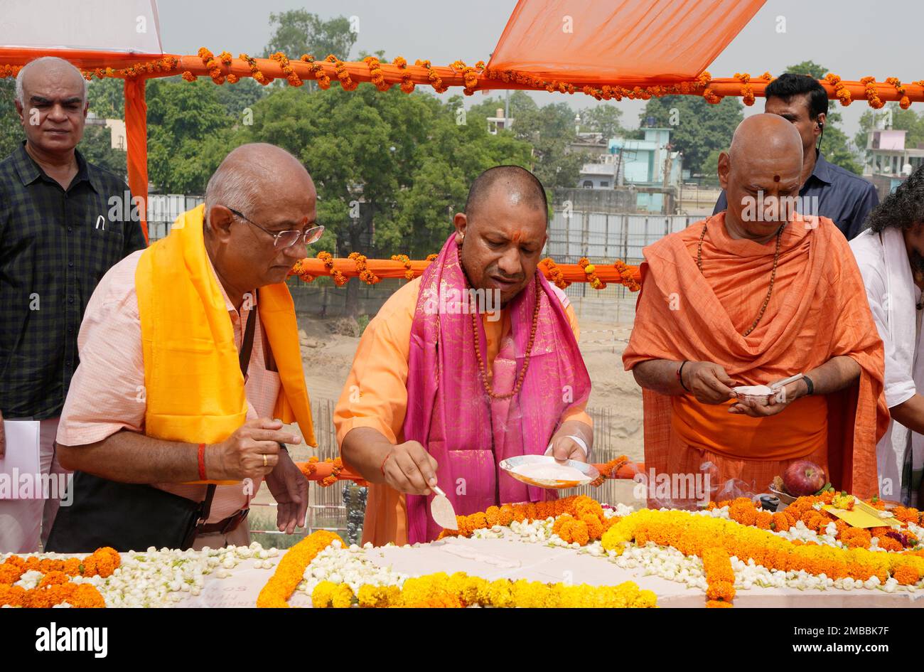 Uttar Pradesh state Chief Minister Yogi Adityanath, center, performs ...