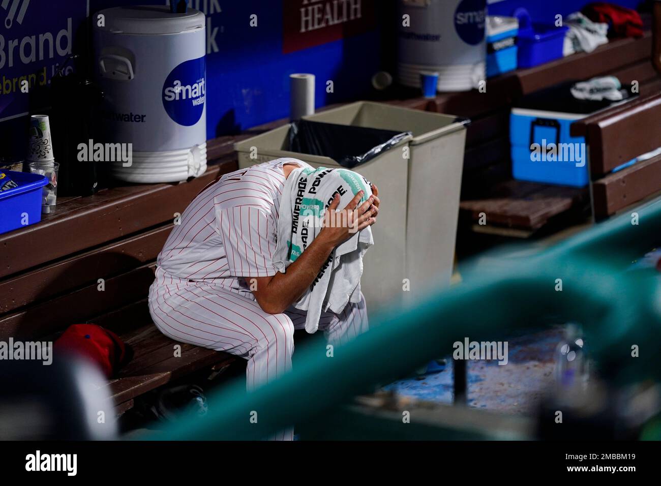 Philadelphia Phillies pitcher Andrew Bellatti sits in the dugout after ...