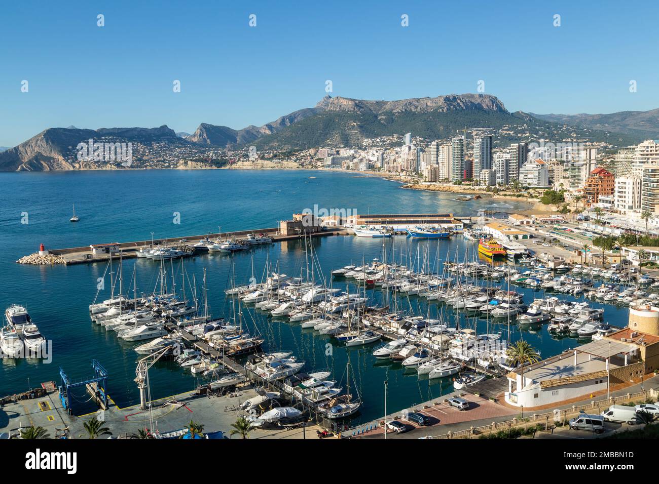 The beautiful town of Calpe and it's harbour with the hill Sierra de ...