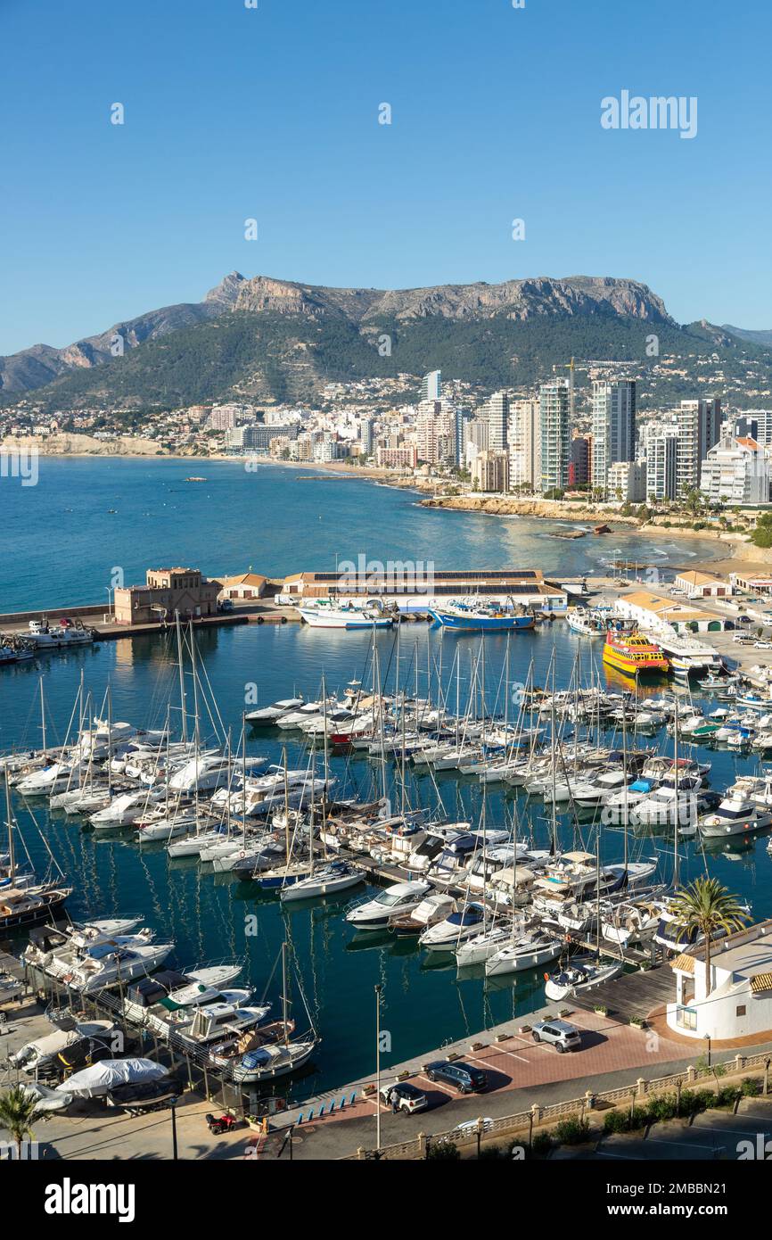 The beautiful town of Calpe and it's harbour with the hill Sierra de ...