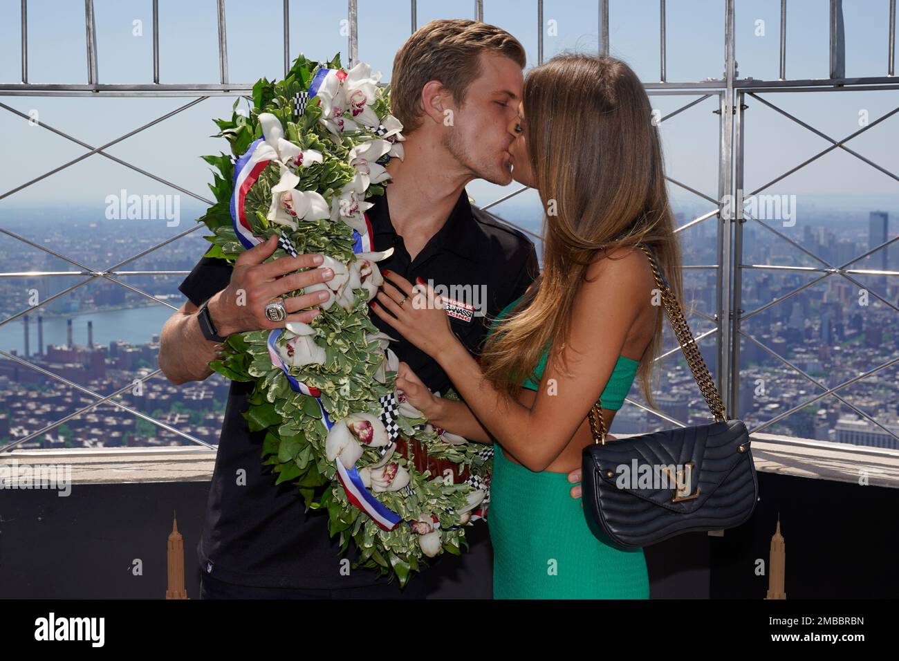 Marcus Ericsson, of Sweden, poses for pictures with girlfriend Iris Jondahl on the observation ...