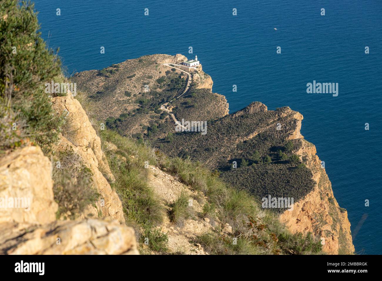 Albir lighthouse at one end of the Sierra Helada natural park, Costa ...