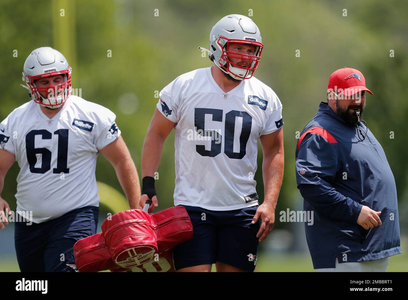 New England Patriots offensive lineman Cole Strange (50) and offensive lineman Drew Desjarlais ...