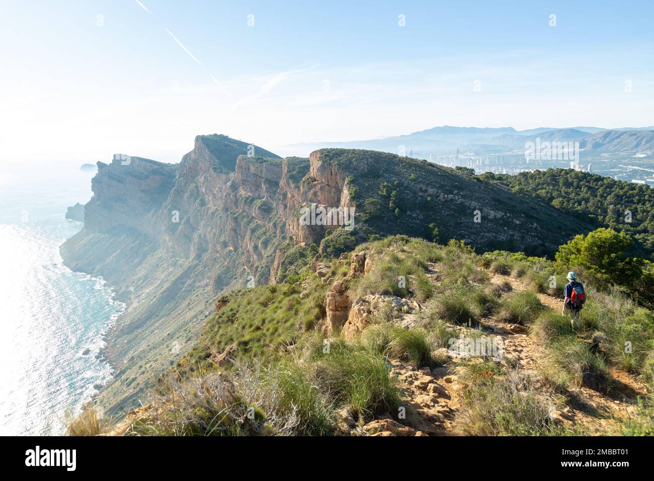 Walking along the footpath in the Serra Gelada Natural Park near ...
