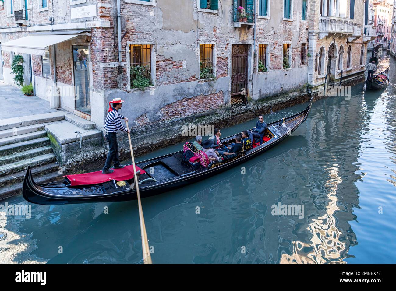 gondola on the move, rio di San Luca, Venice Italy Stock Photo - Alamy