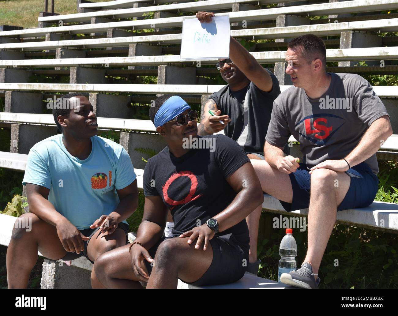 Capt. Brandon Robinson, secretary to the general staff, holds up the ...