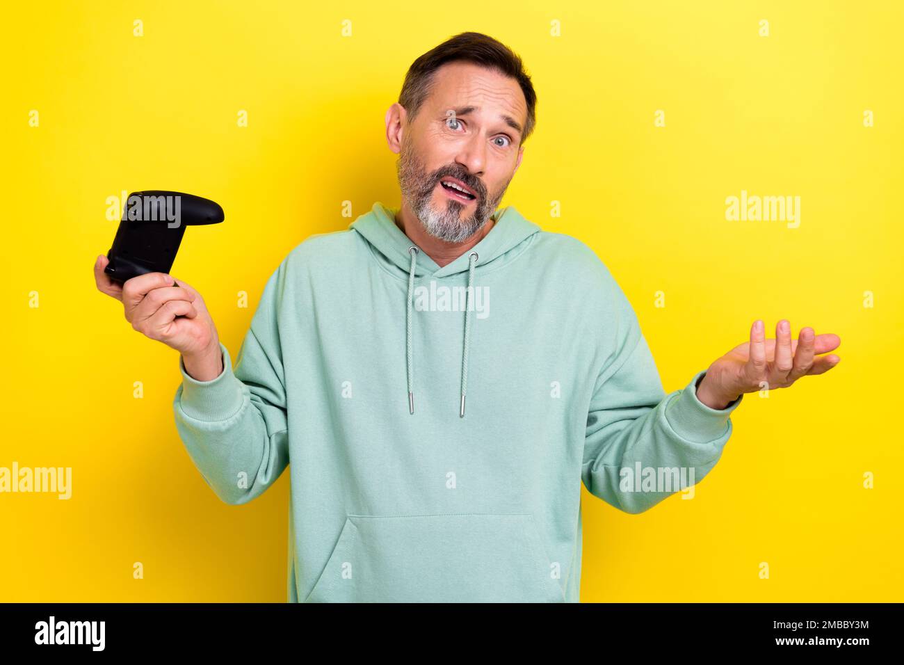 Portrait of worried man raise hand no answer cant complete game level ...