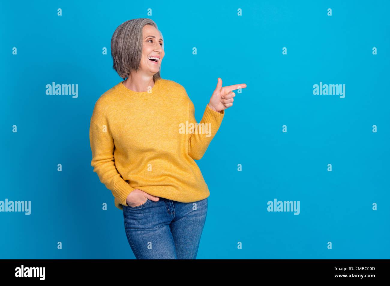 Photo portrait of mature lovely lady point finger empty space laughing ...