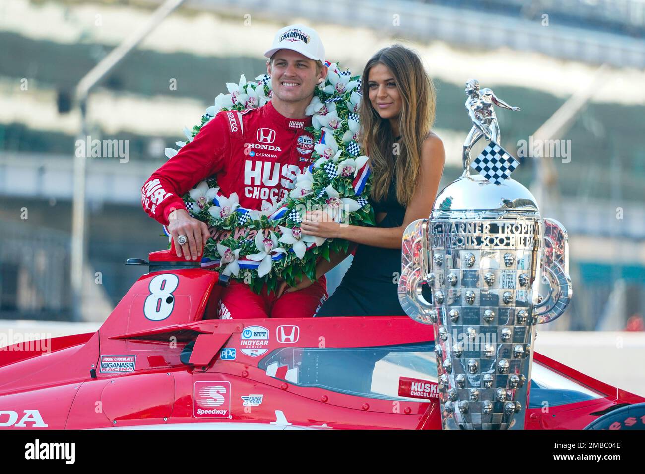 Marcus Ericsson, of Sweden, poses with girlfriend Iris Tritsaris ...