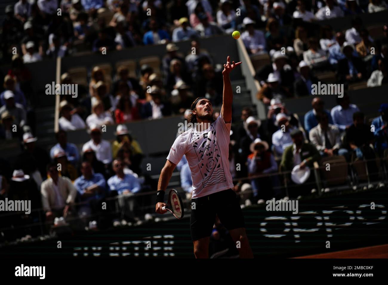 Greece's Stefanos Tsitsipas serves against Denmark's Holger Rune during their fourth round match ...