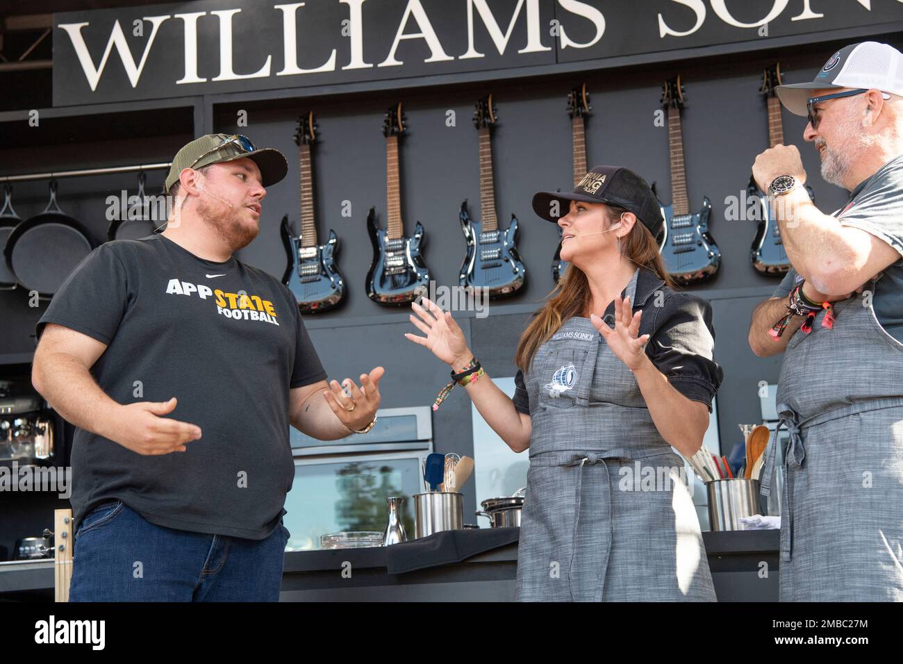 Luke Combs, left, Tiffani Thiessen, and Andrew Zimmern are seen at the ...