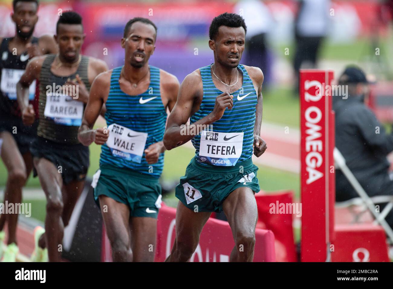 Ethiopia's Samuel Tefera and Getnet Wale run in the men's 5,000 meters ...