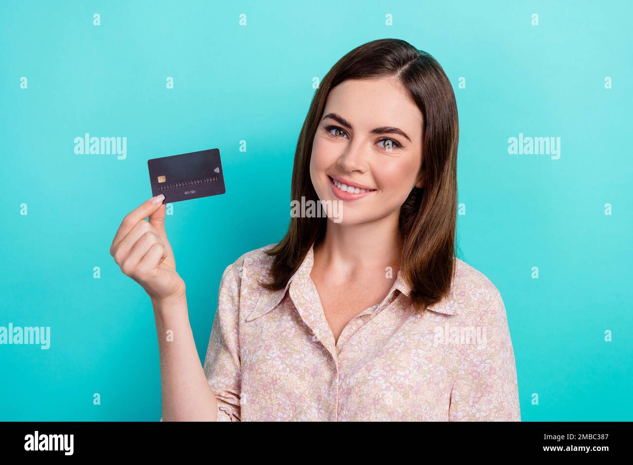 Photo of shiny cheerful lady wear pink shirt rising bank credit card ...