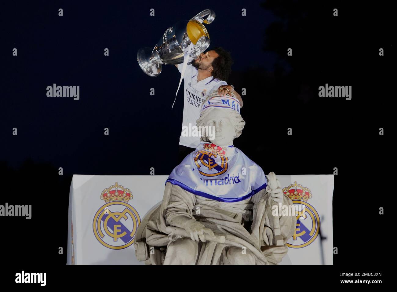 Real Madrid player Marcelo kisses the trophy at the Cibeles square ...