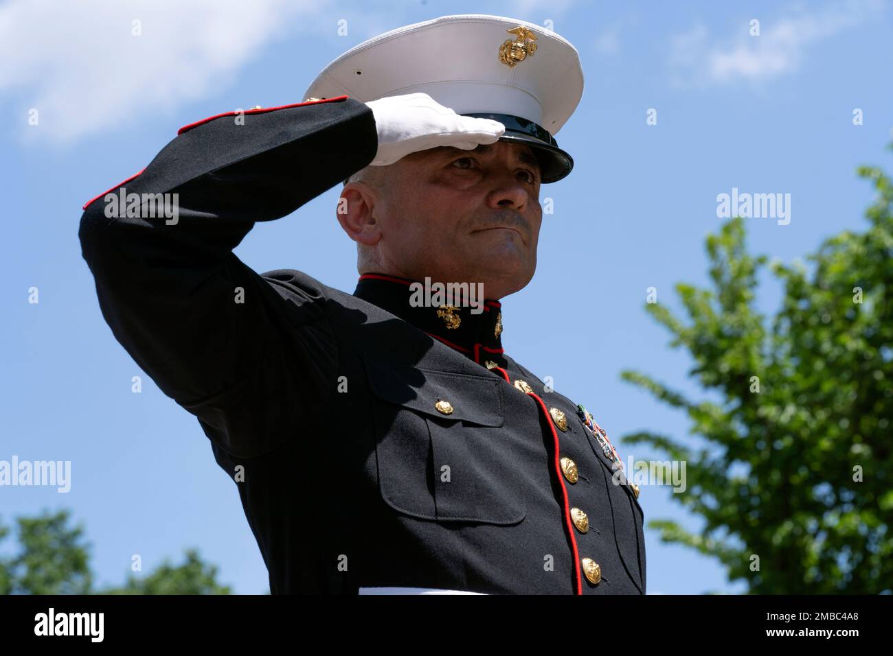 U.S. Marine Corps Staff Sgt. Tim Chambers salutes as participants in ...